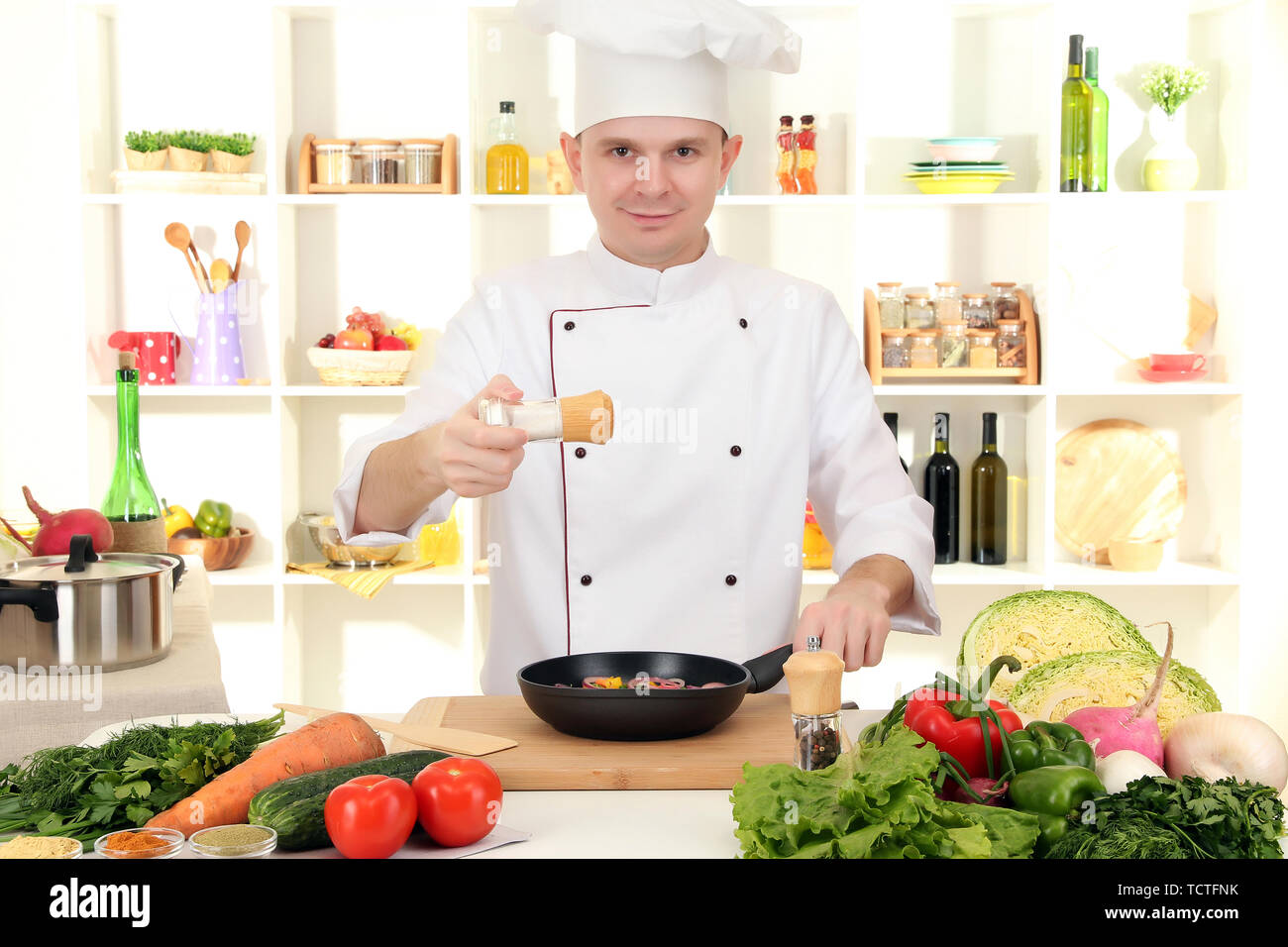 Chef cooking in kitchen Stock Photo - Alamy