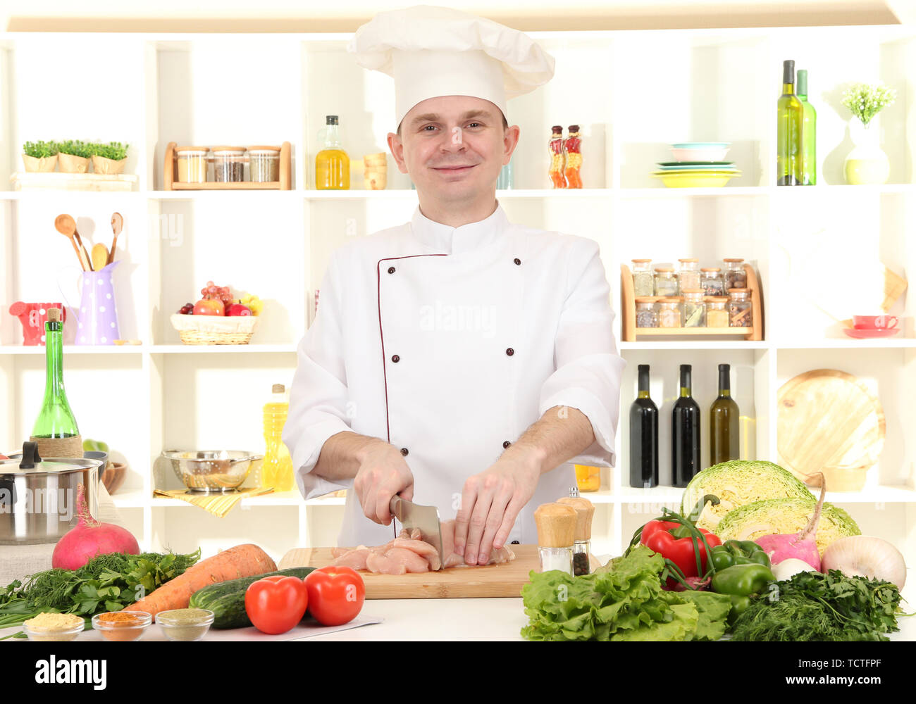 Chef cooking in kitchen Stock Photo - Alamy