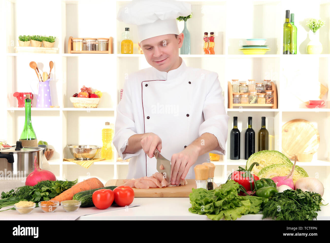 Chef cooking in kitchen Stock Photo - Alamy