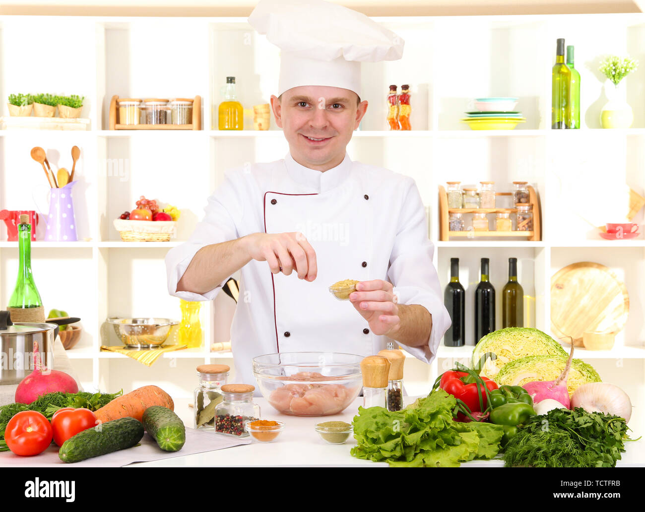 Chef cooking in kitchen Stock Photo - Alamy