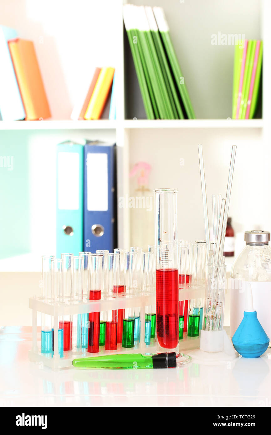 Different laboratory glassware with color liquid on laboratory ...
