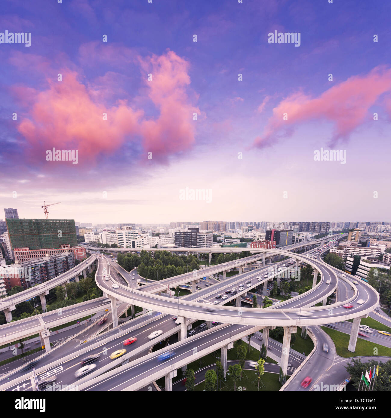 skyline and traffic trails on highway intersection Stock Photo - Alamy