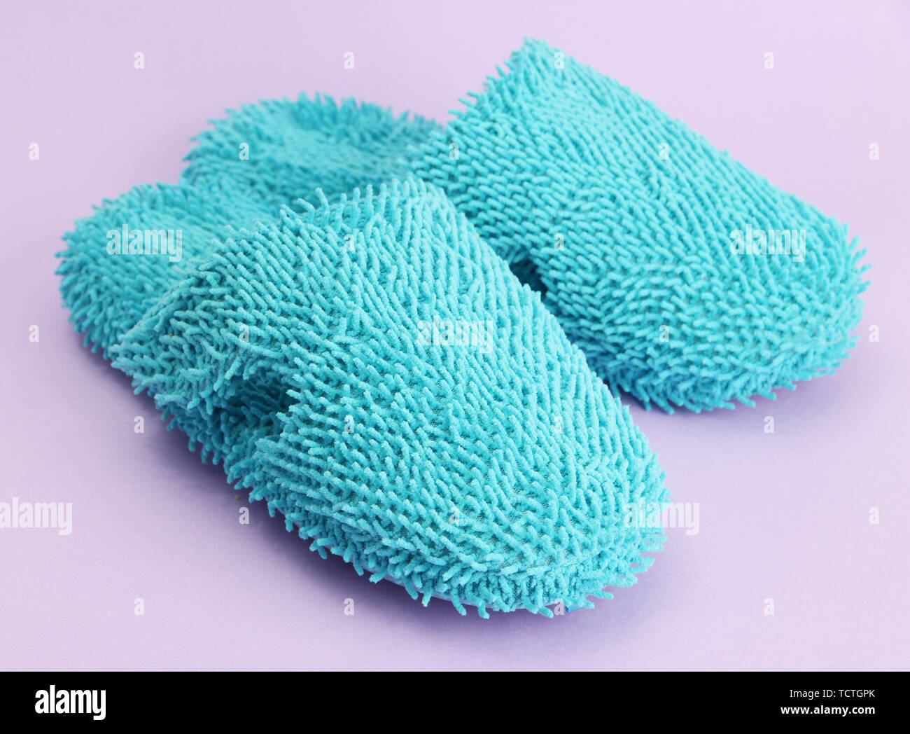 bright slippers, on purple background Stock Photo - Alamy