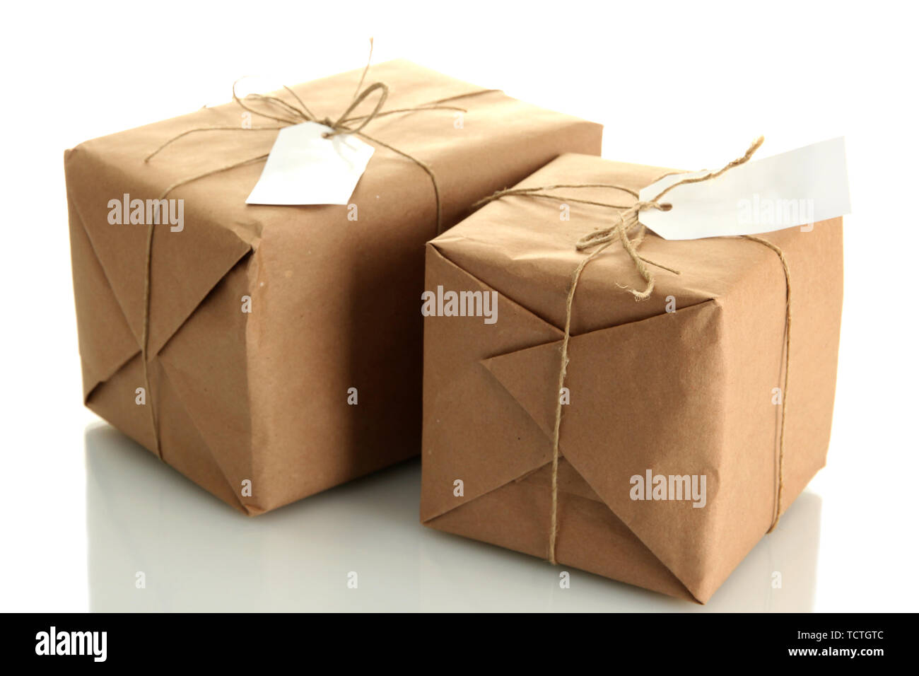 parcels boxes with kraft paper, isolated on white Stock Photo - Alamy