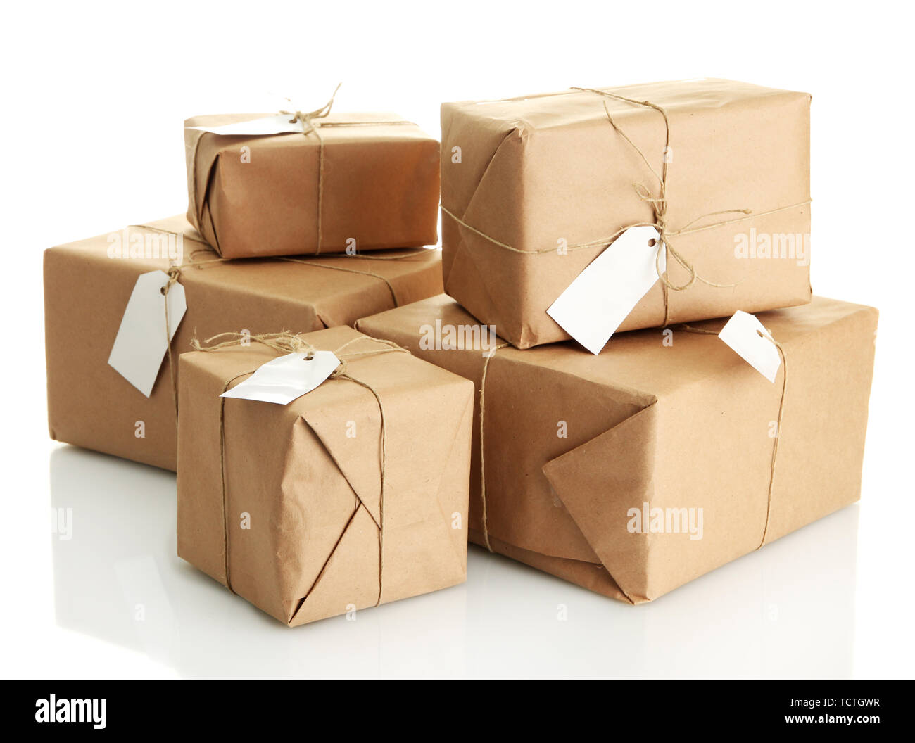 parcels boxes with kraft paper, isolated on white Stock Photo - Alamy
