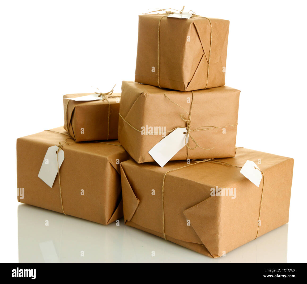 parcels boxes with kraft paper, isolated on white Stock Photo - Alamy