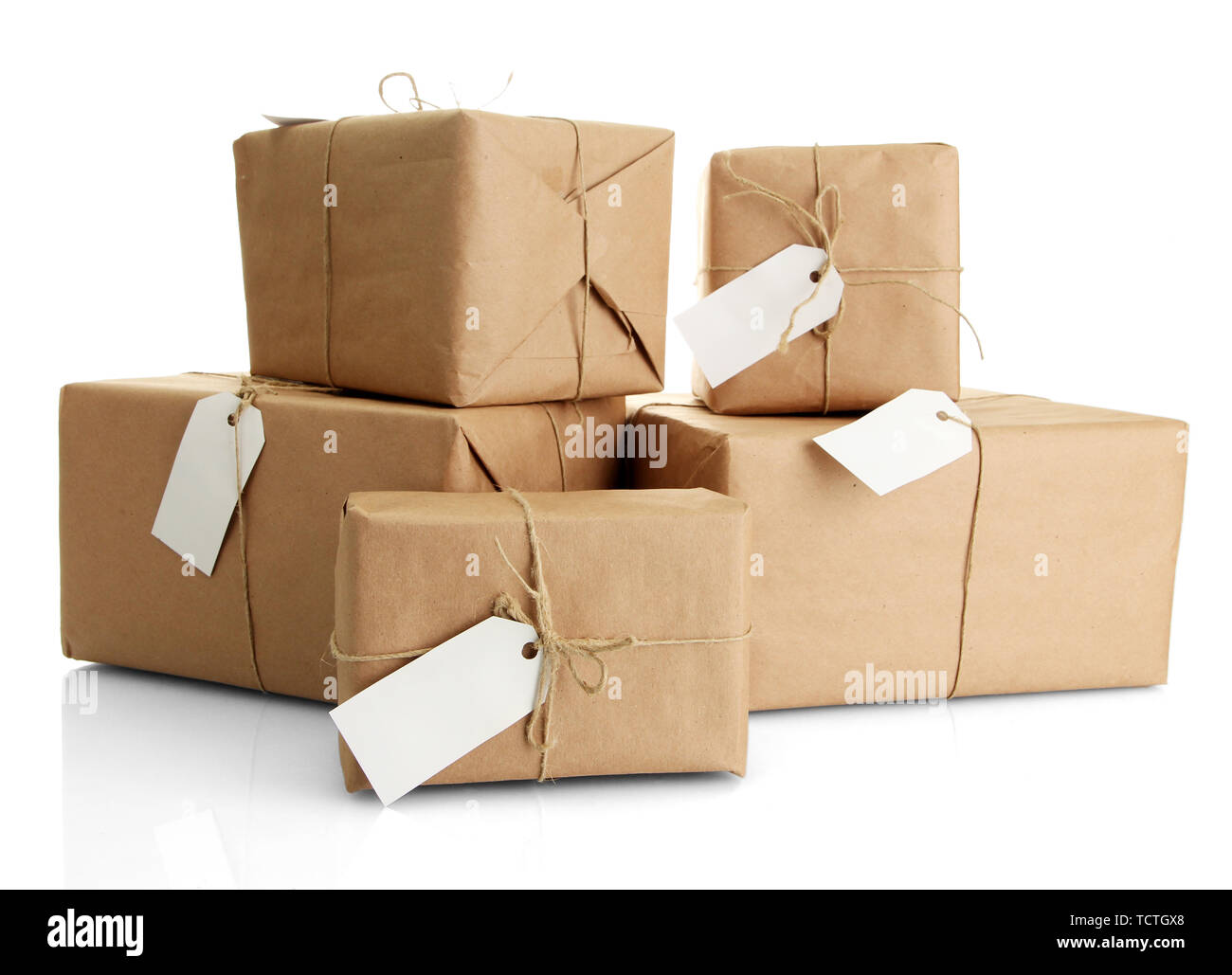parcels boxes with kraft paper, isolated on white Stock Photo - Alamy