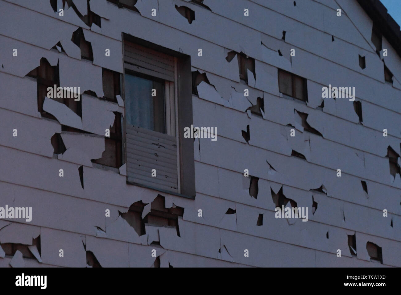 Germering, Germany. 10th June, 2019. A cladding of a house wall damaged ...