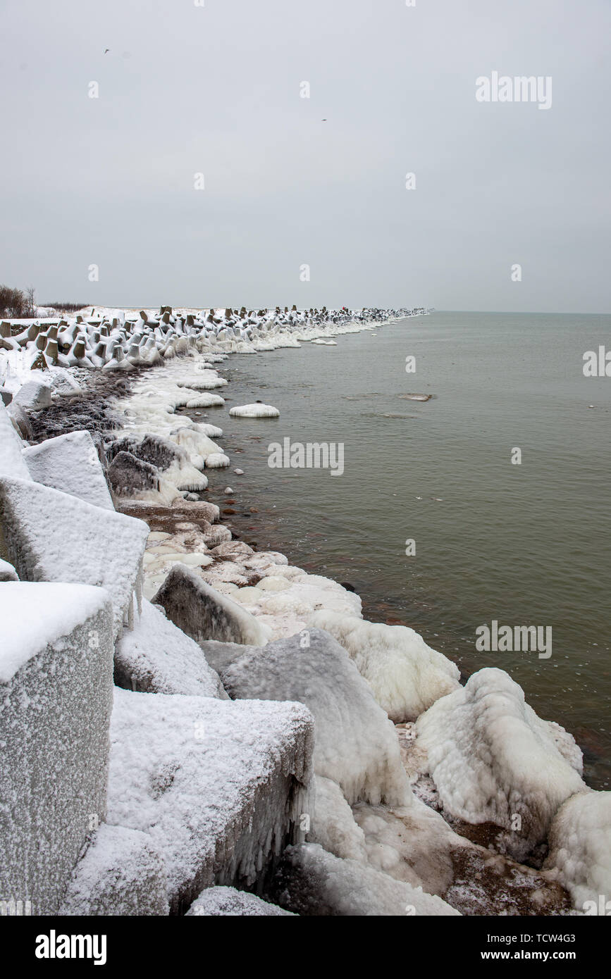 pieces of frozen ice in the lake in dim winter day under snow Stock ...