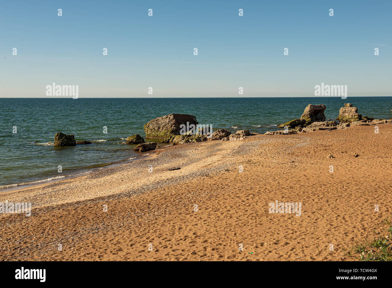 large rock in sand in countryside, isolated stone Stock Photo - Alamy