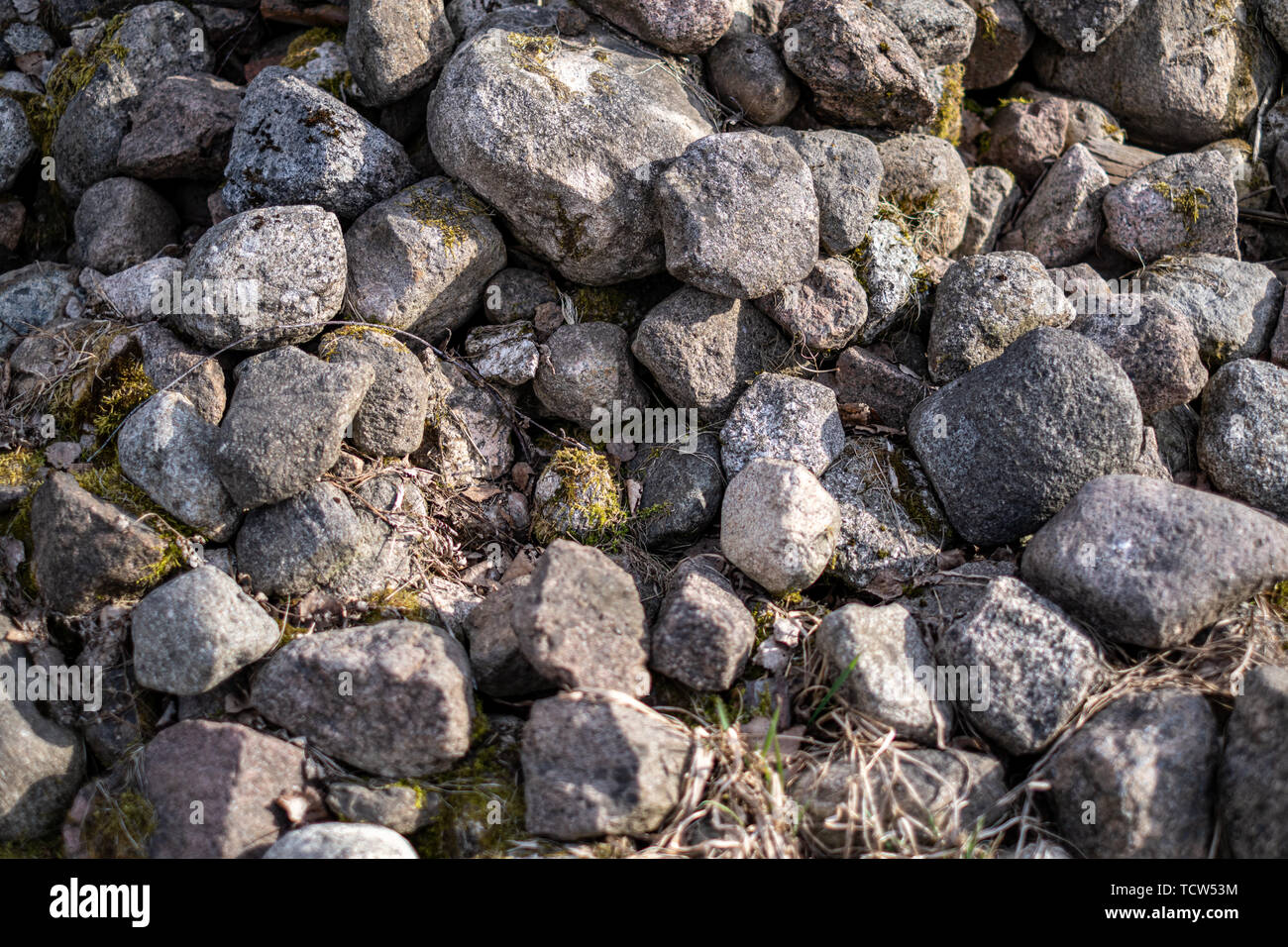 large rock in sand in countryside, isolated stone Stock Photo - Alamy