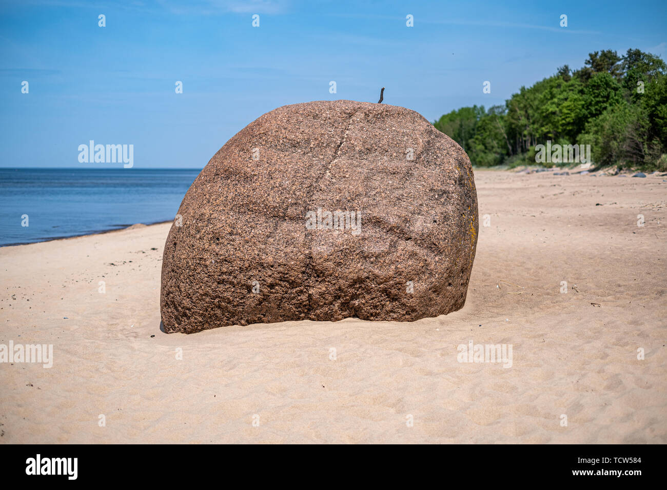 large rock in sand in countryside, isolated stone Stock Photo - Alamy