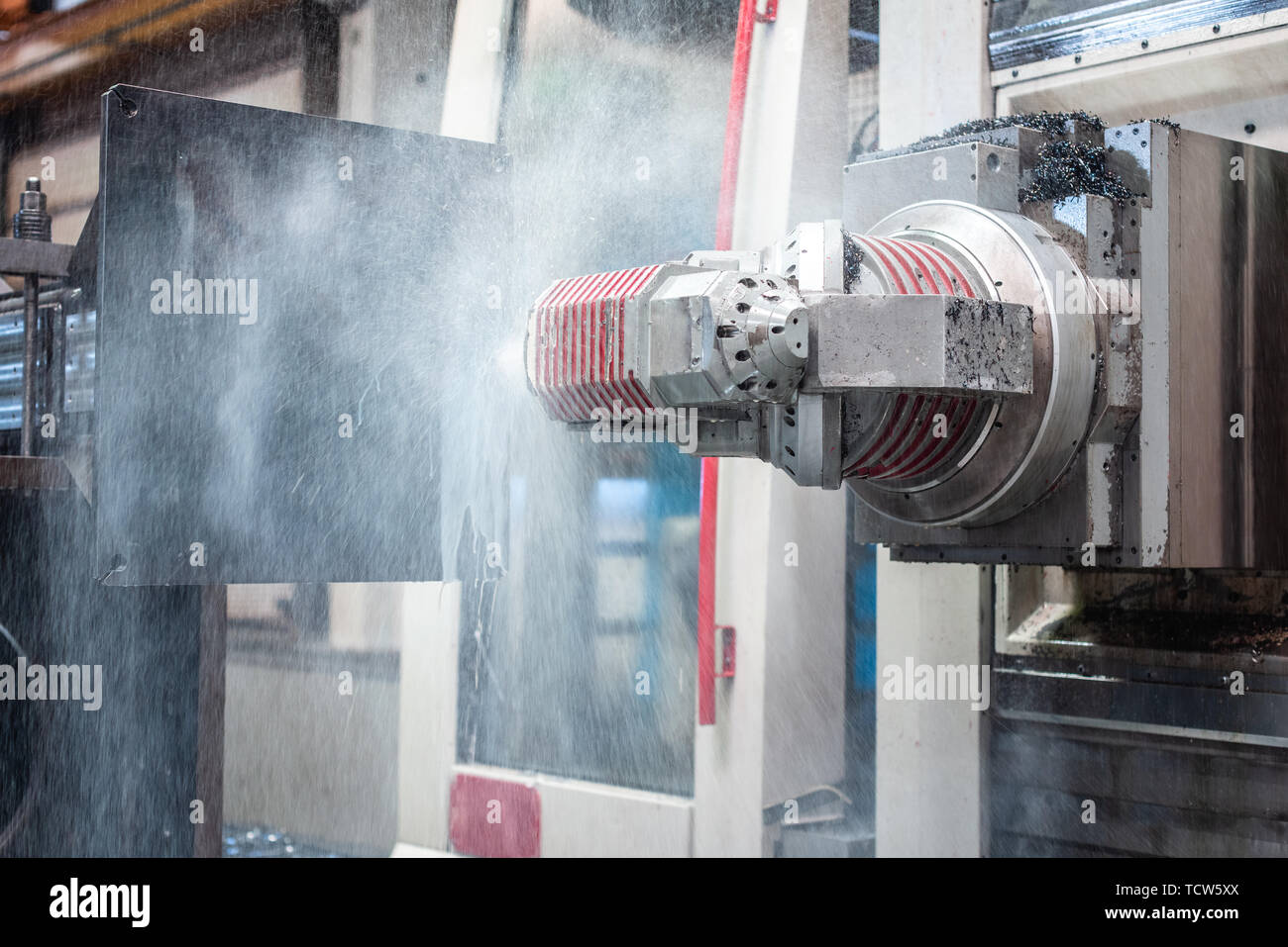 Industrial milling machine robot working on workpiece Stock Photo - Alamy