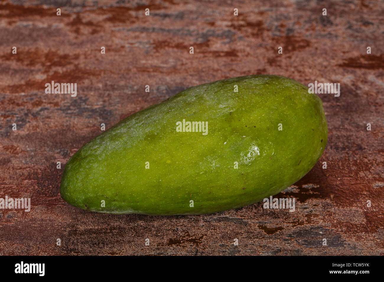 Green tasty mango over background Stock Photo - Alamy