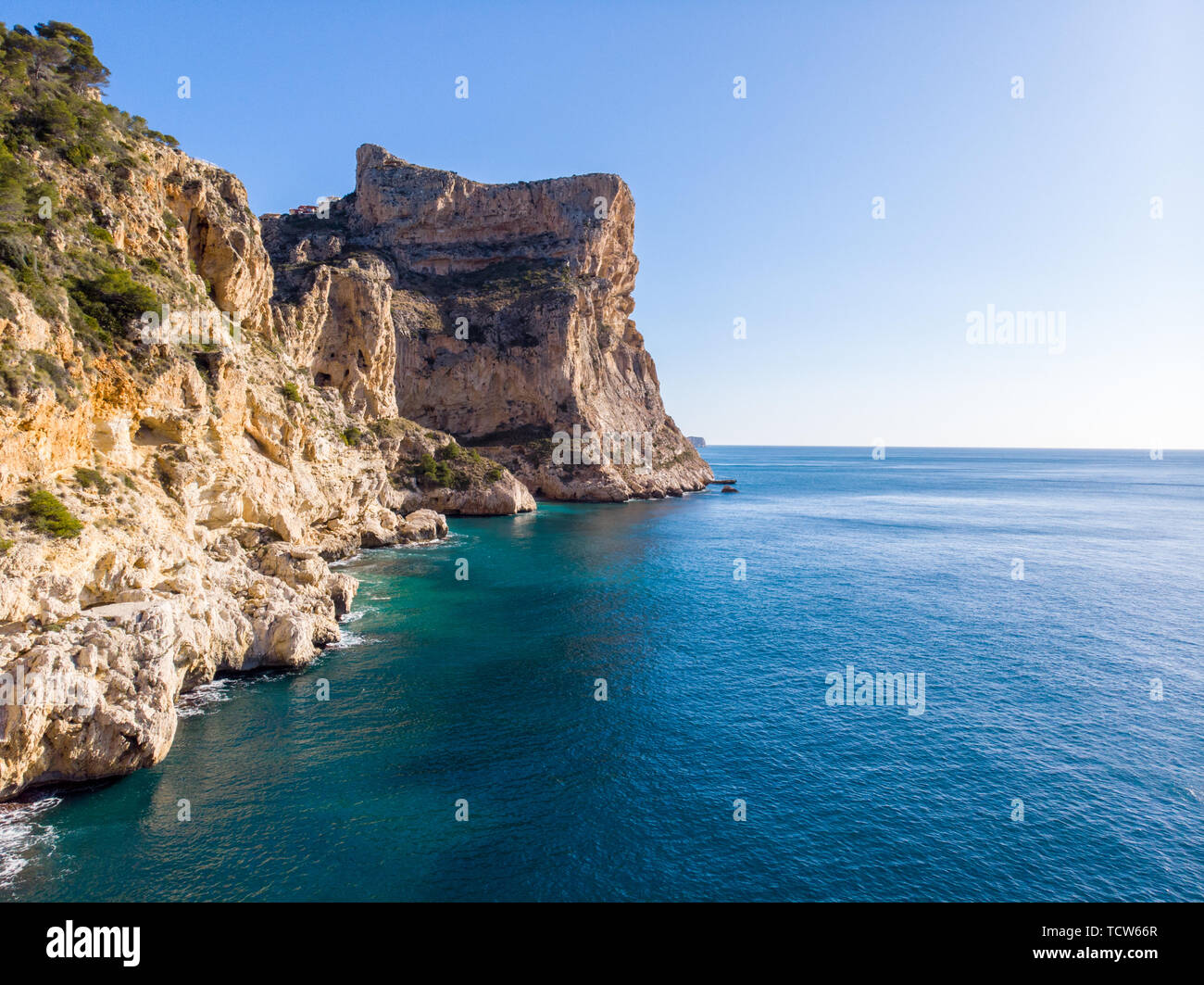 Cliffs in Moraig cove beach in Benitatxell, Alicante, Spain Stock Photo ...