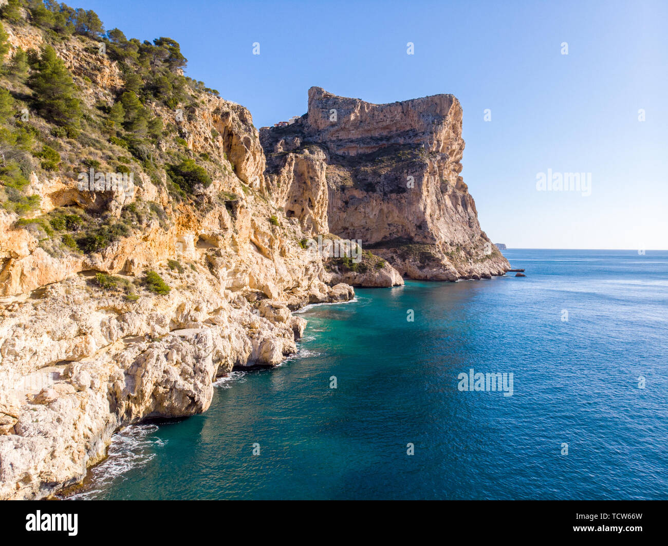 Cliffs in Moraig cove beach in Benitatxell, Alicante, Spain Stock Photo ...
