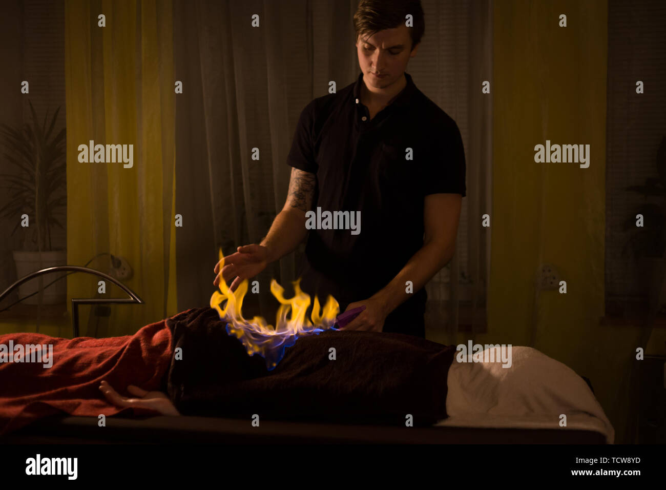Chinese fire massage and therapy Stock Photo - Alamy