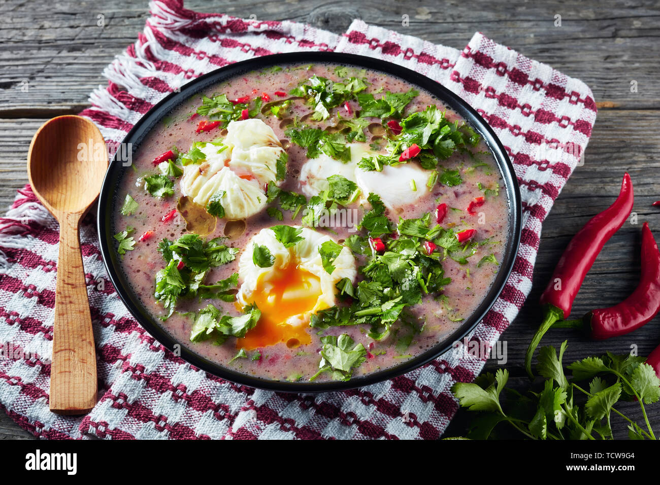 hot mexican spicy red kidney Bean Soup with poached eggs and cilantro ...