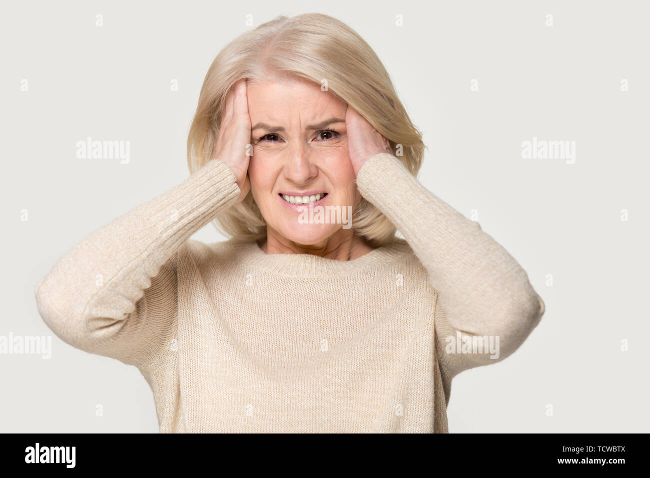Old woman head in hands hi-res stock photography and images - Alamy