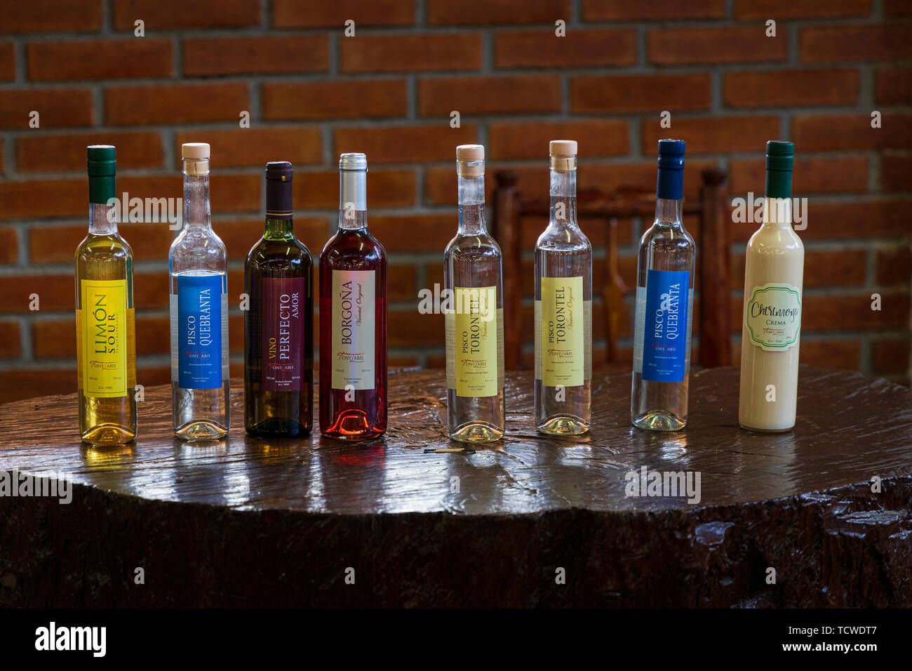 Bottles of various flavours of Pisco in the Tony Labis winery and pisco ...