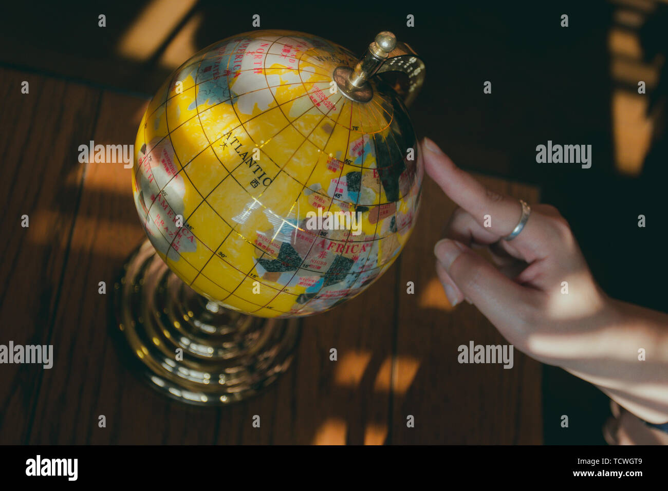 Hand and globe Stock Photo - Alamy