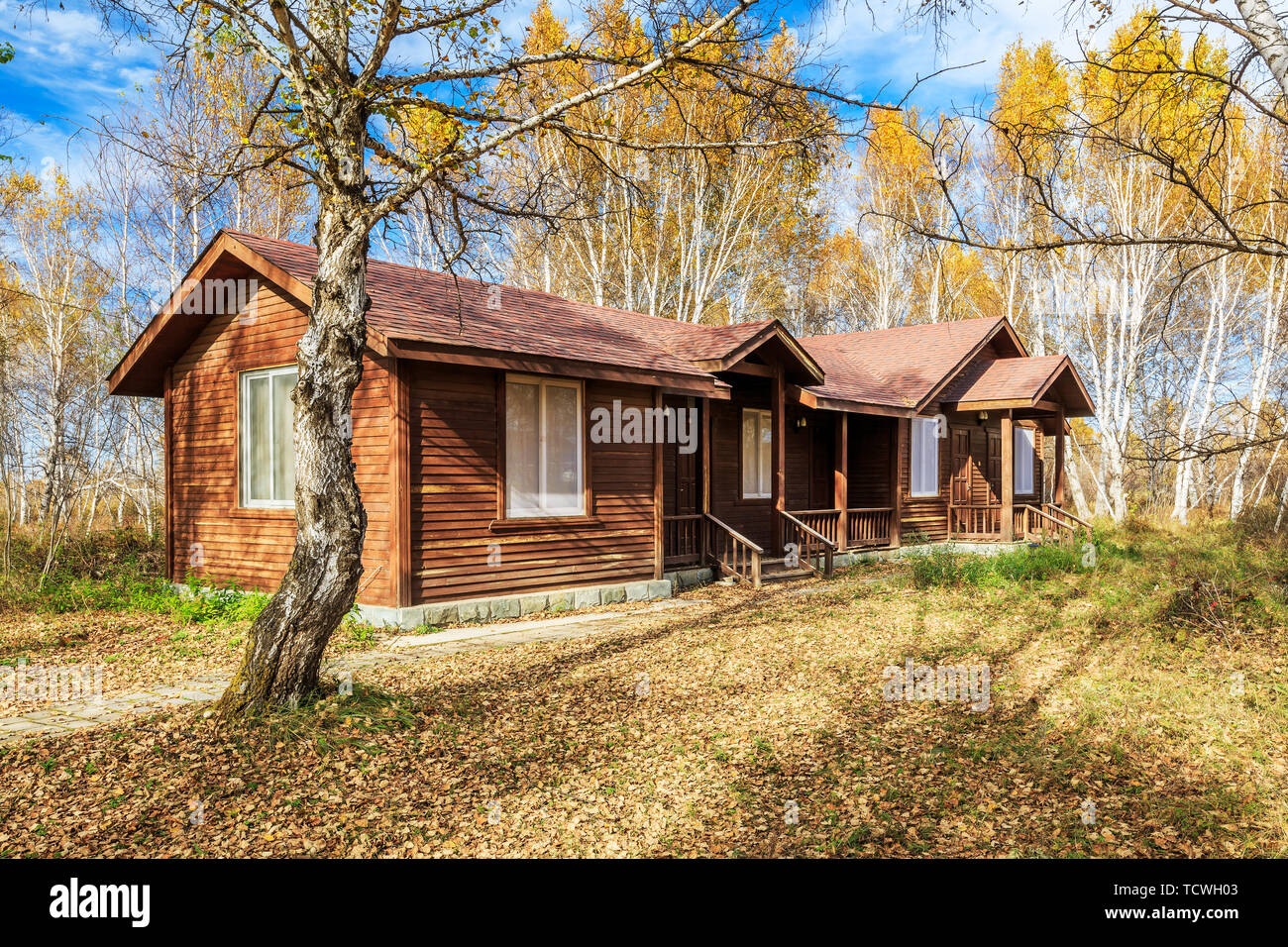 Paddock dam on sun lake lake wooden house autumn color Stock Photo - Alamy