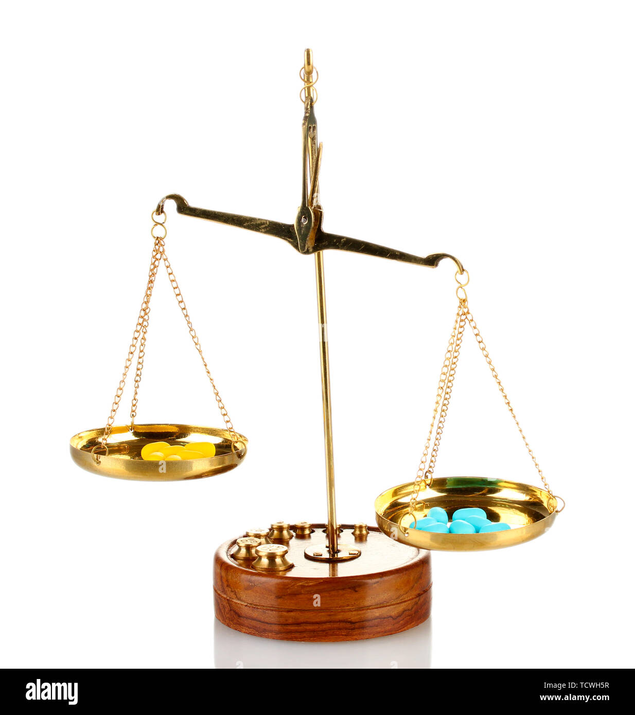 Classic scales with color pills isolated on white Stock Photo - Alamy