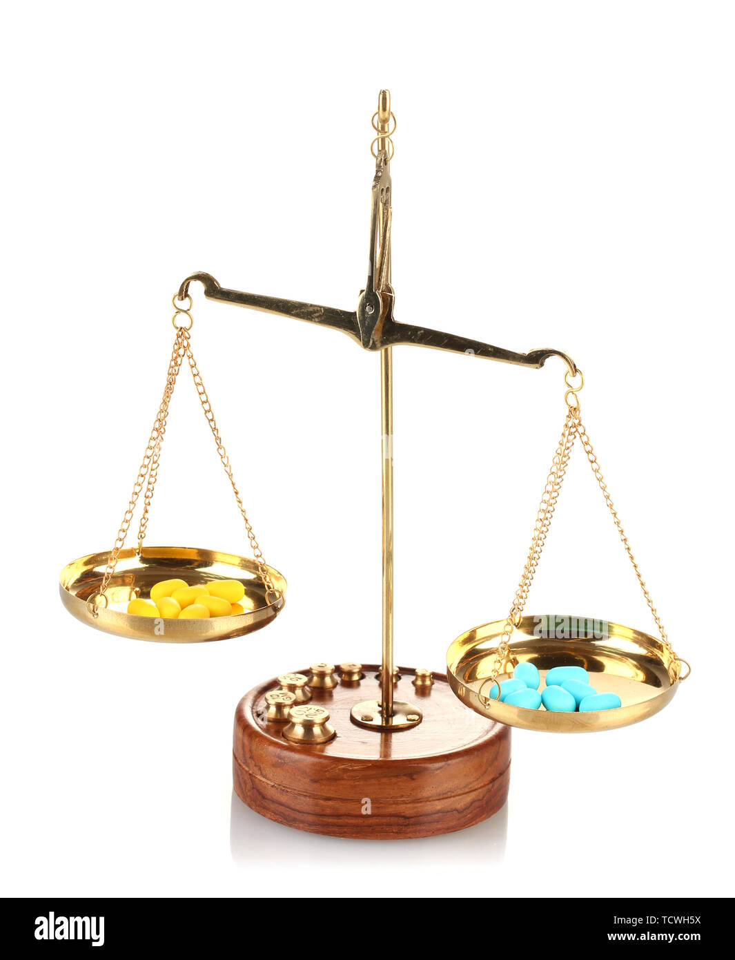 Classic scales with color pills isolated on white Stock Photo - Alamy