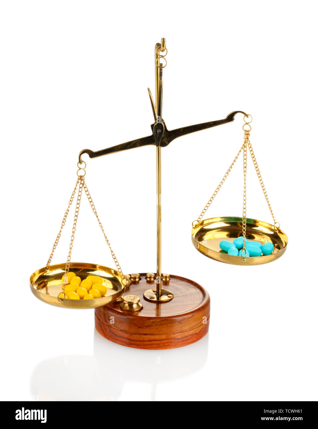 Classic scales with color pills isolated on white Stock Photo - Alamy