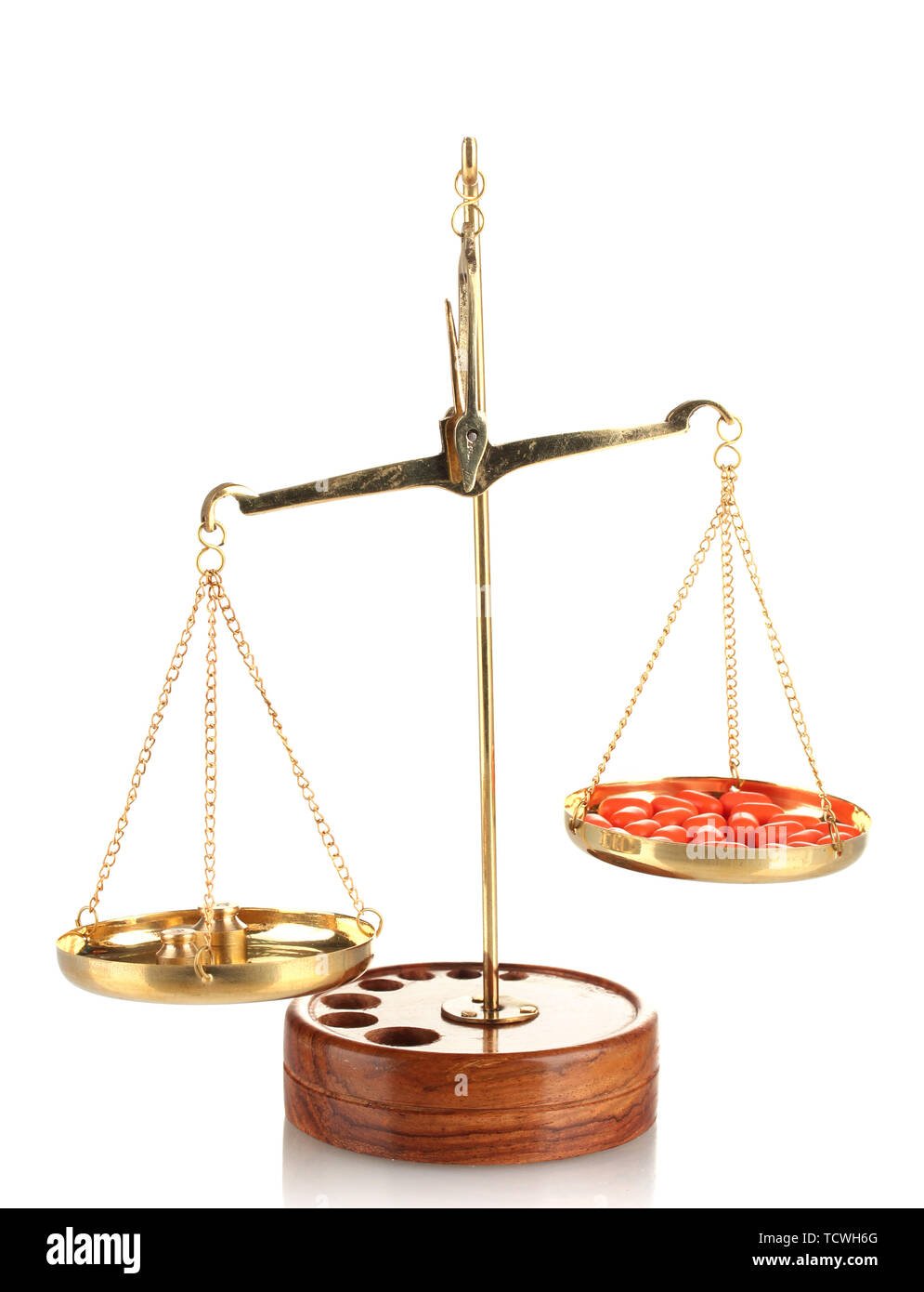 Classic scales with color pills isolated on white Stock Photo - Alamy