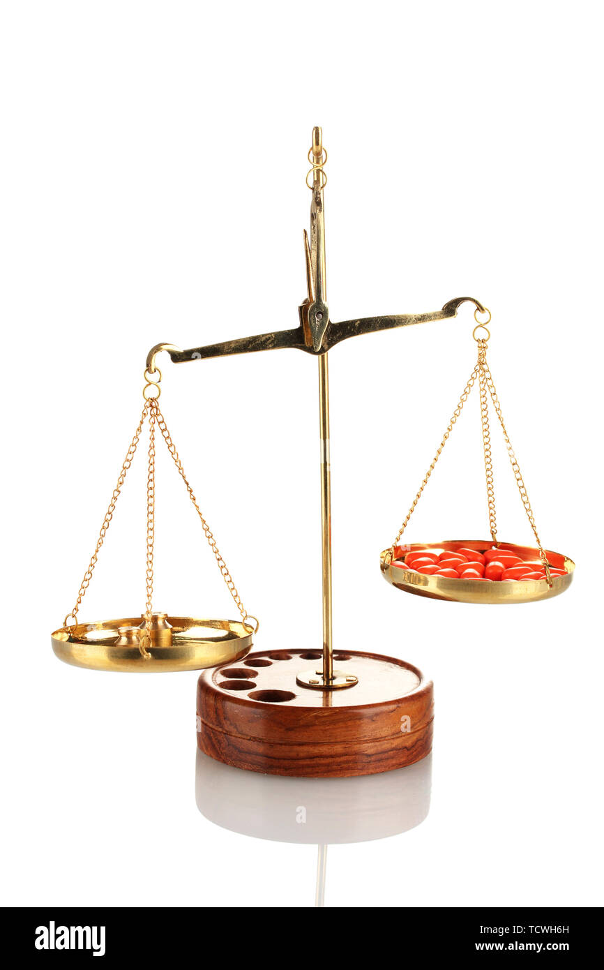 Classic scales with color pills isolated on white Stock Photo - Alamy