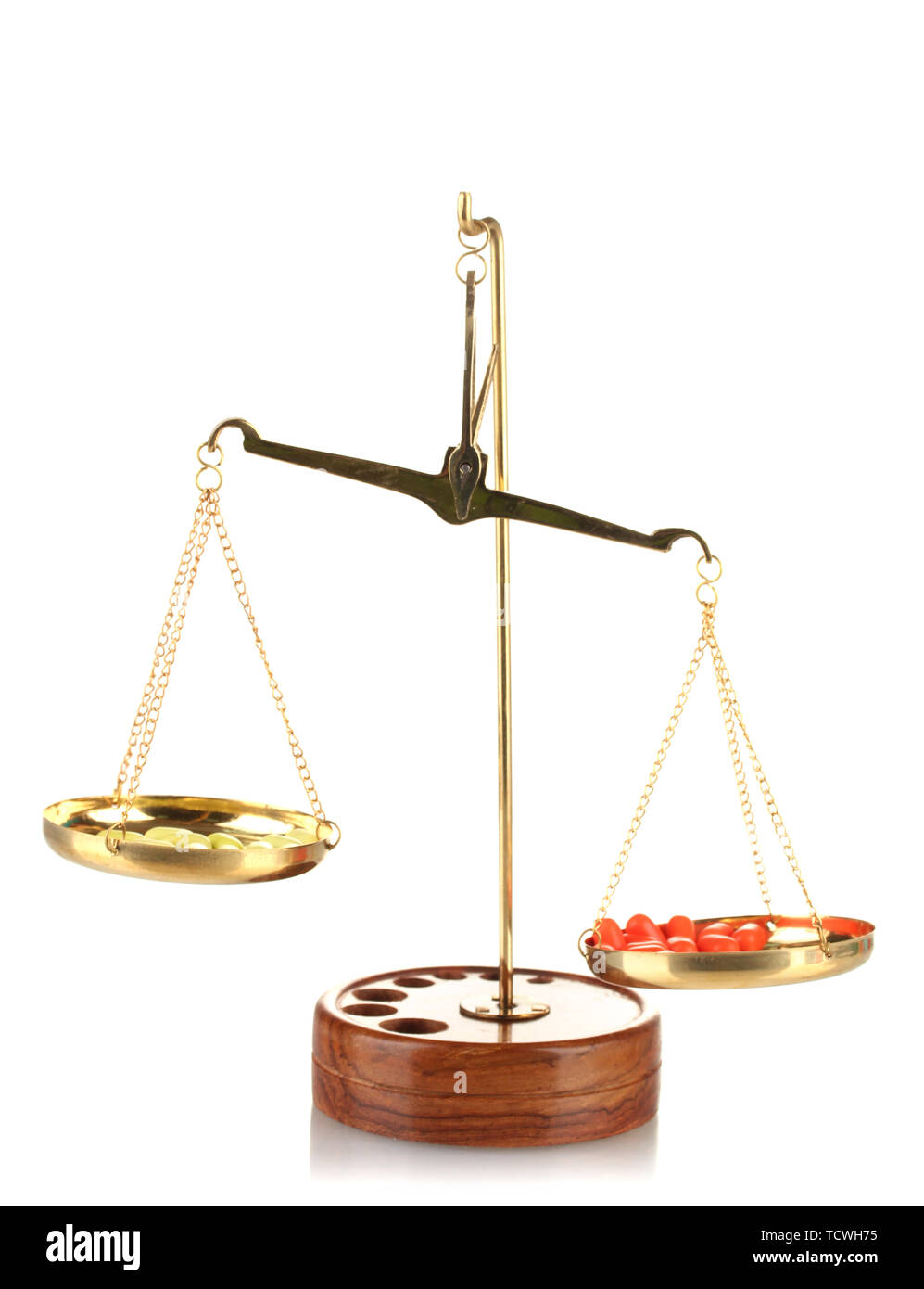 Classic scales with color pills isolated on white Stock Photo - Alamy