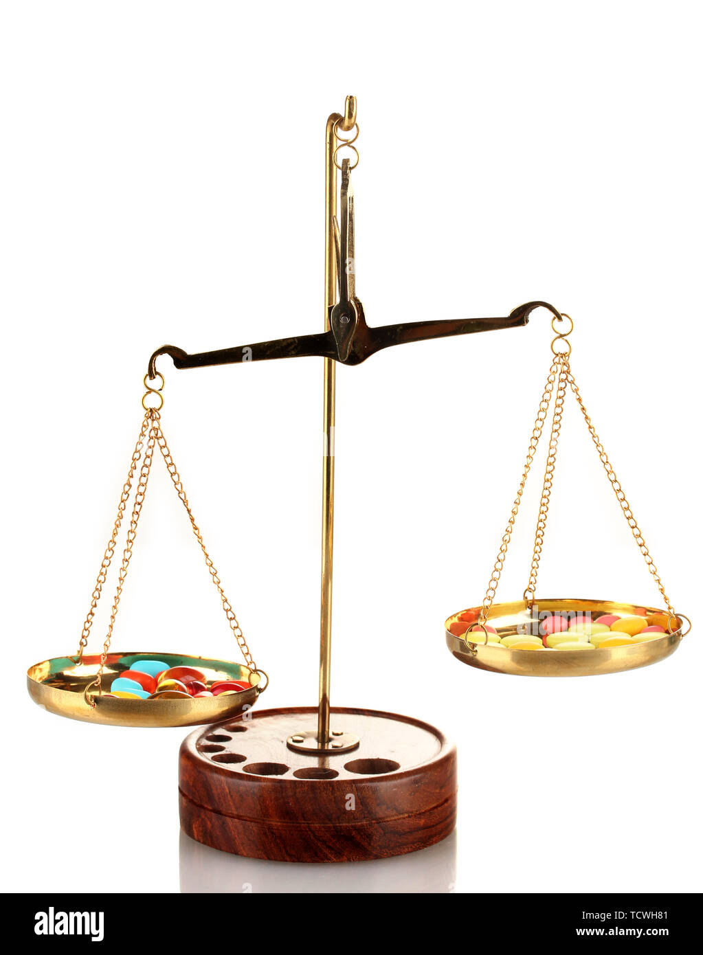 Classic scales with color pills isolated on white Stock Photo - Alamy