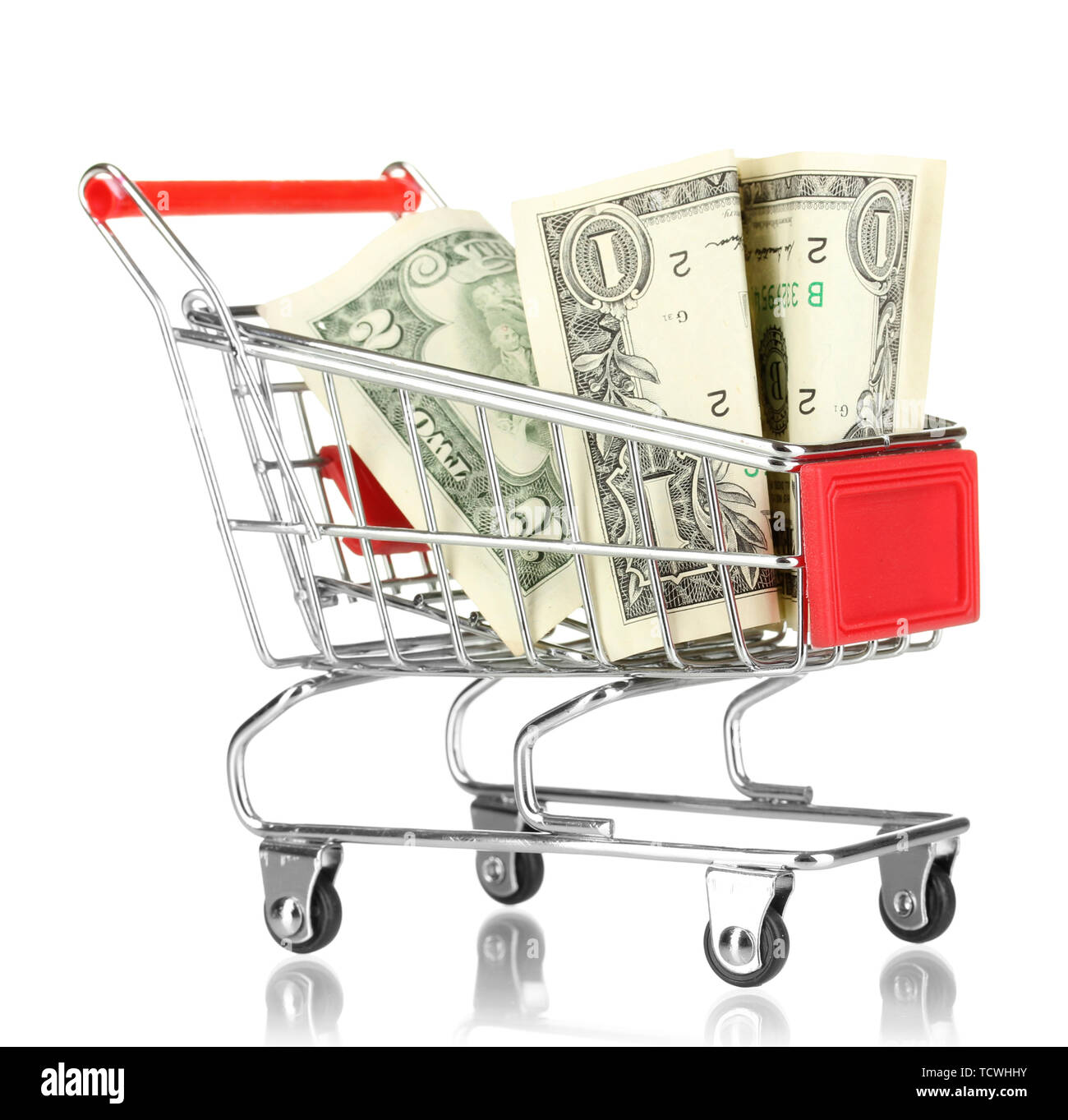 Money in cart isolated on white Stock Photo - Alamy