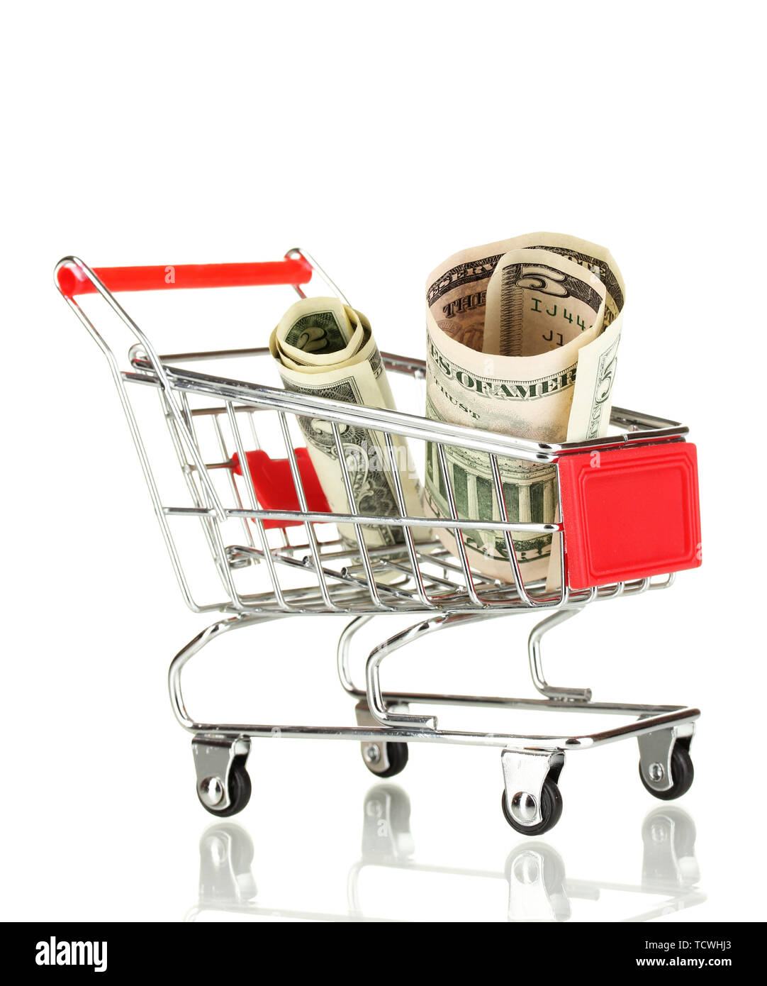 Money in cart isolated on white Stock Photo - Alamy