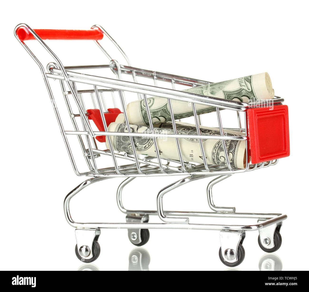 Money in cart isolated on white Stock Photo - Alamy