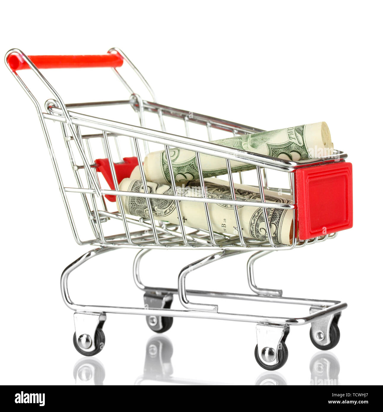 Money in cart isolated on white Stock Photo - Alamy