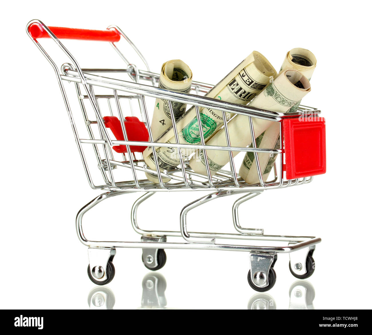 Money in cart isolated on white Stock Photo - Alamy