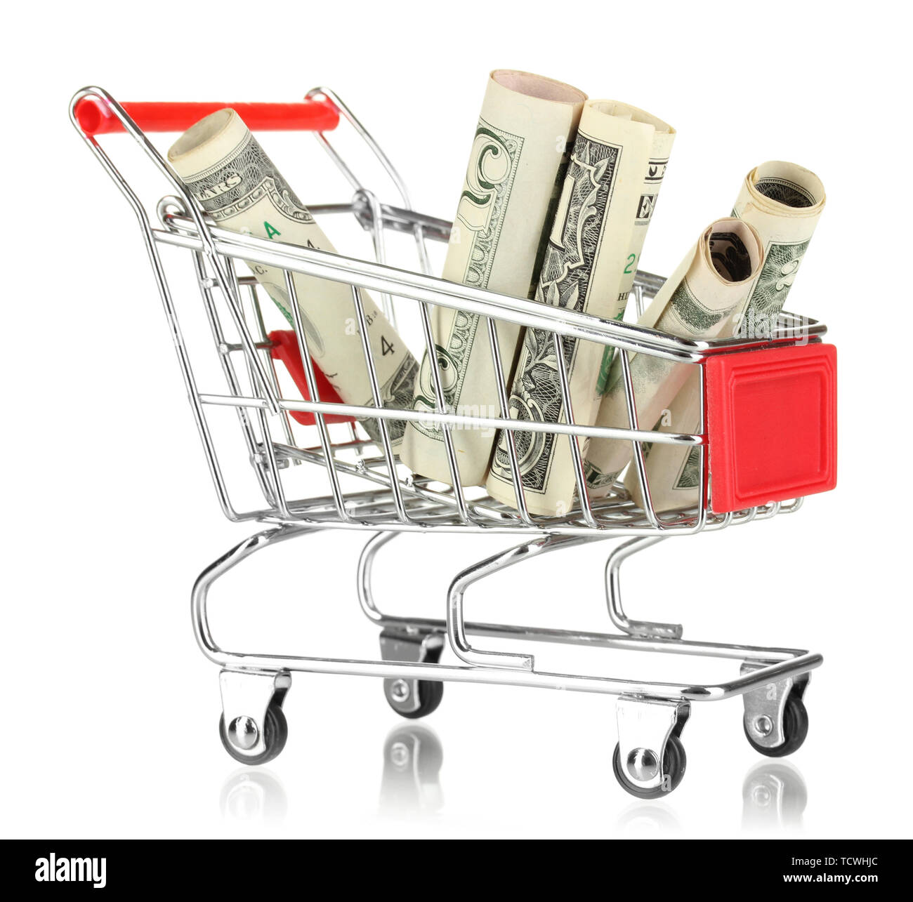Money in cart isolated on white Stock Photo - Alamy