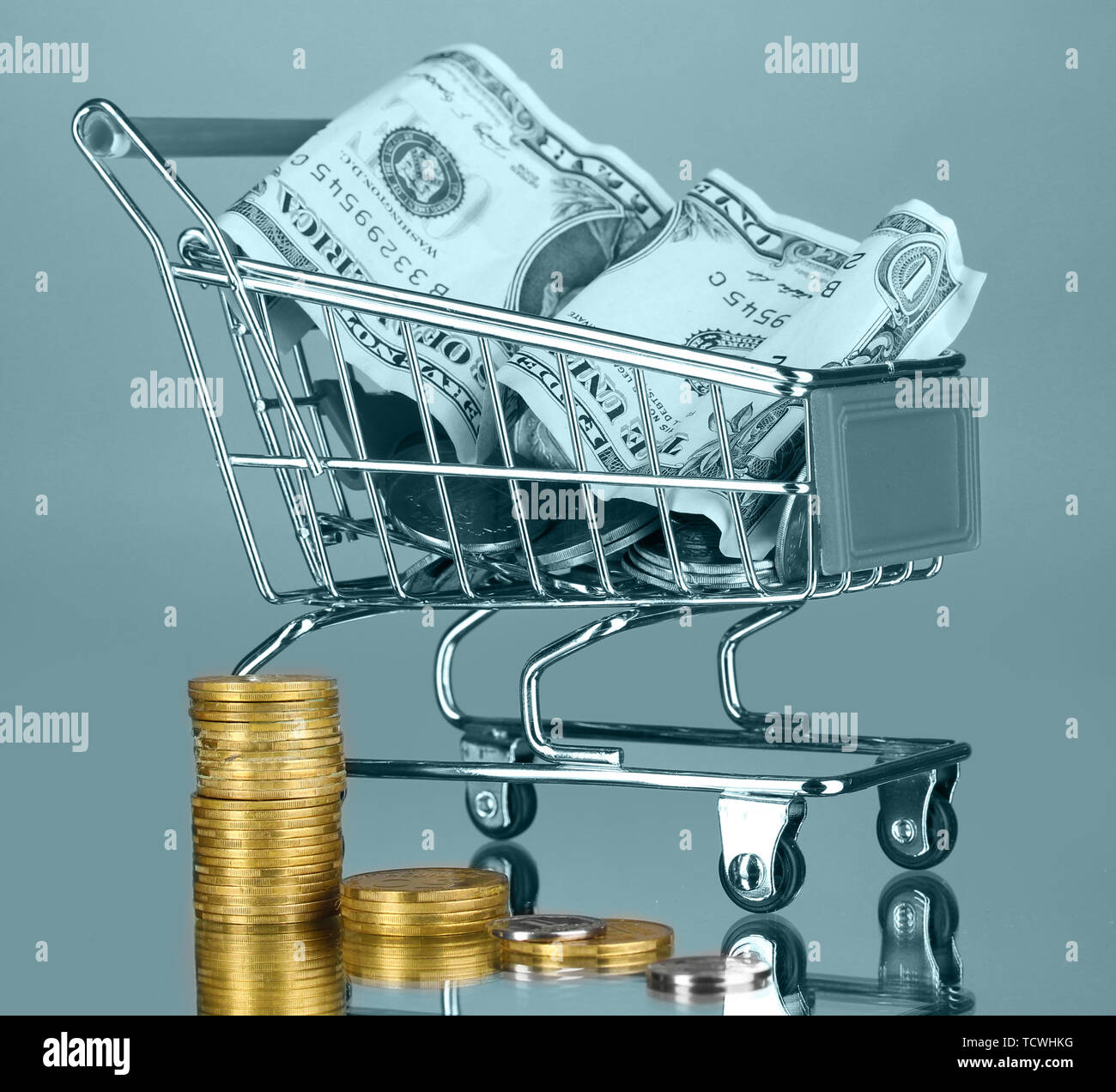 Money in cart in green light Stock Photo - Alamy