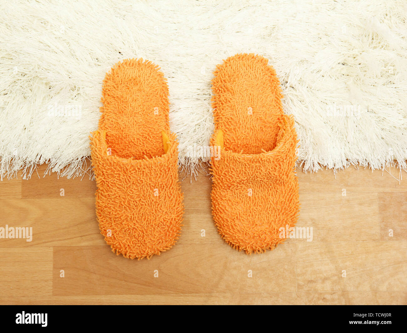 bright slippers, on floor background Stock Photo - Alamy