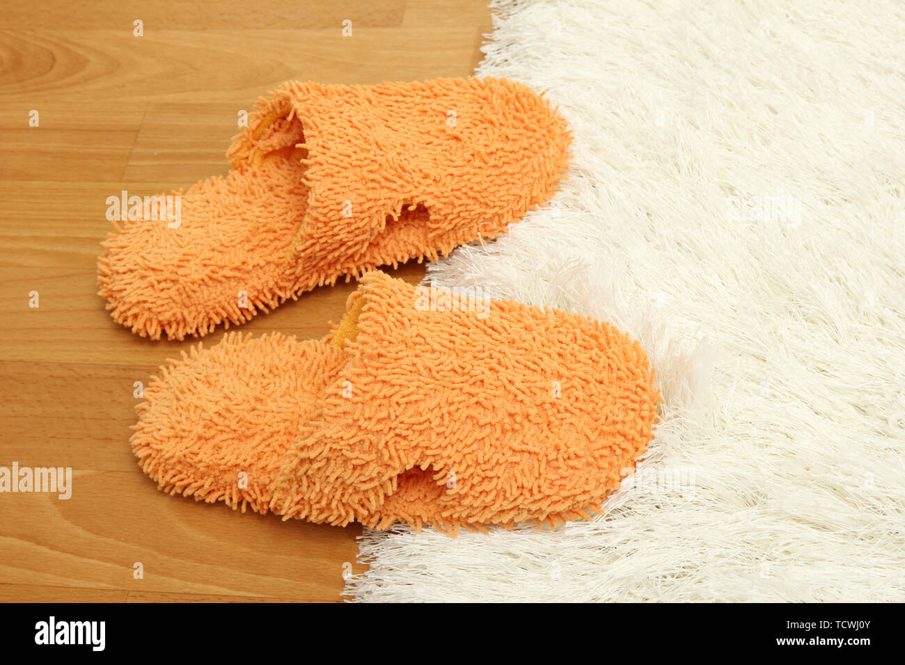 bright slippers, on floor background Stock Photo - Alamy