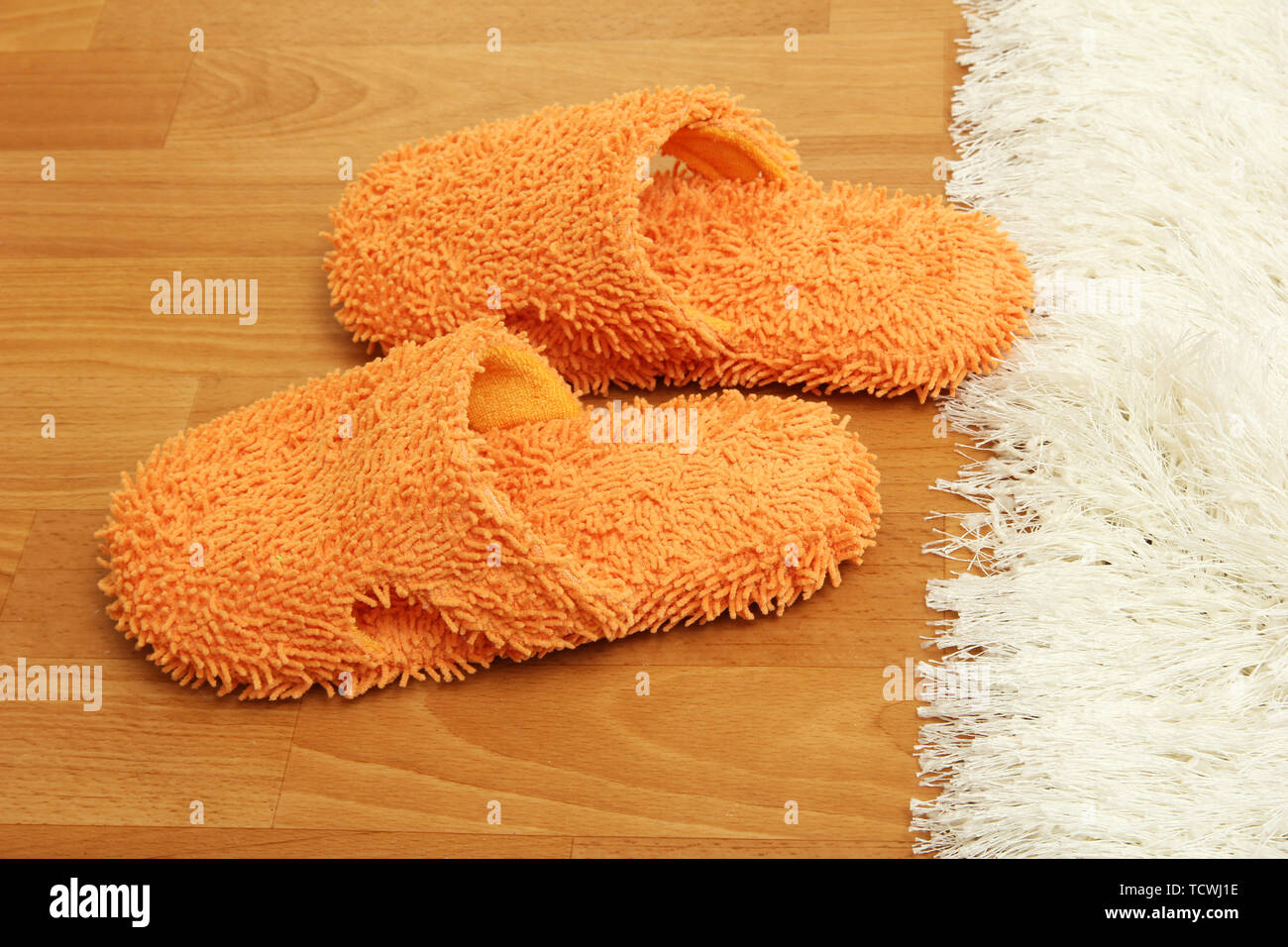 bright slippers, on floor background Stock Photo - Alamy