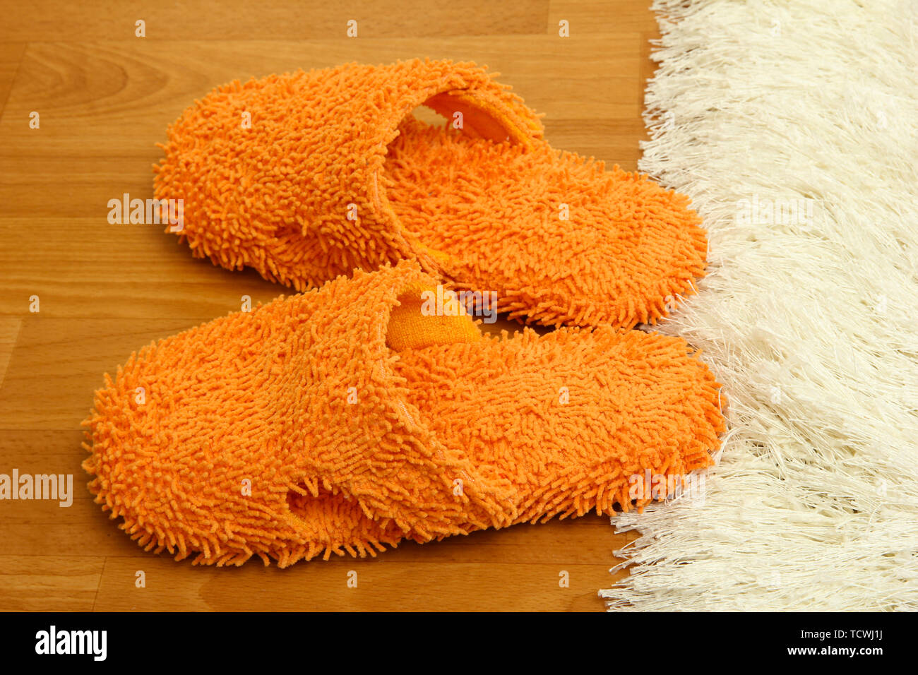 bright slippers, on floor background Stock Photo - Alamy
