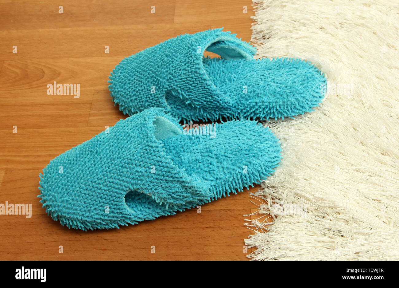 bright slippers, on floor background Stock Photo - Alamy