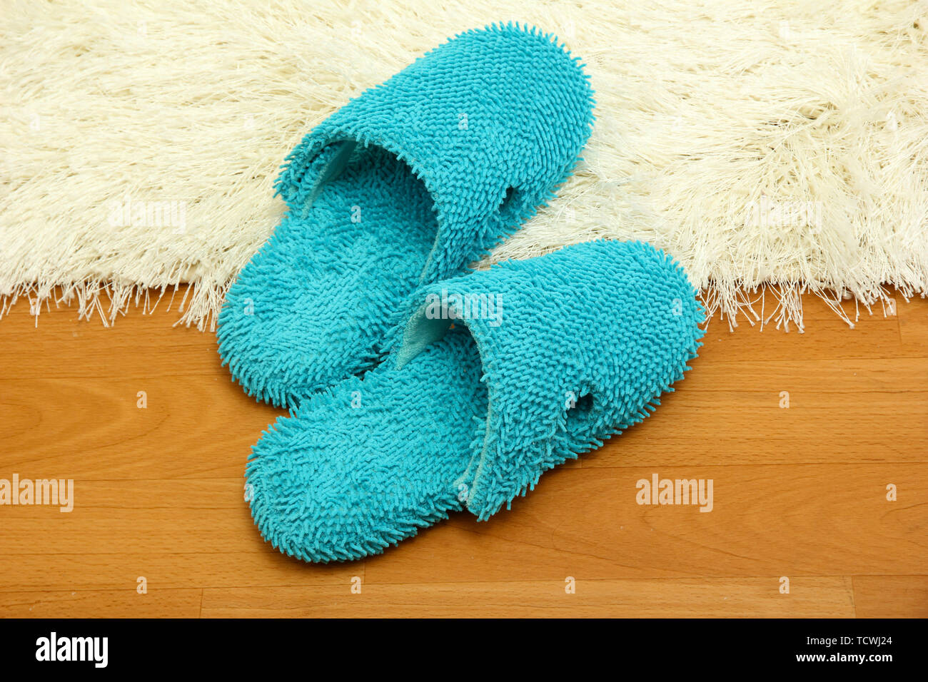 bright slippers, on floor background Stock Photo - Alamy
