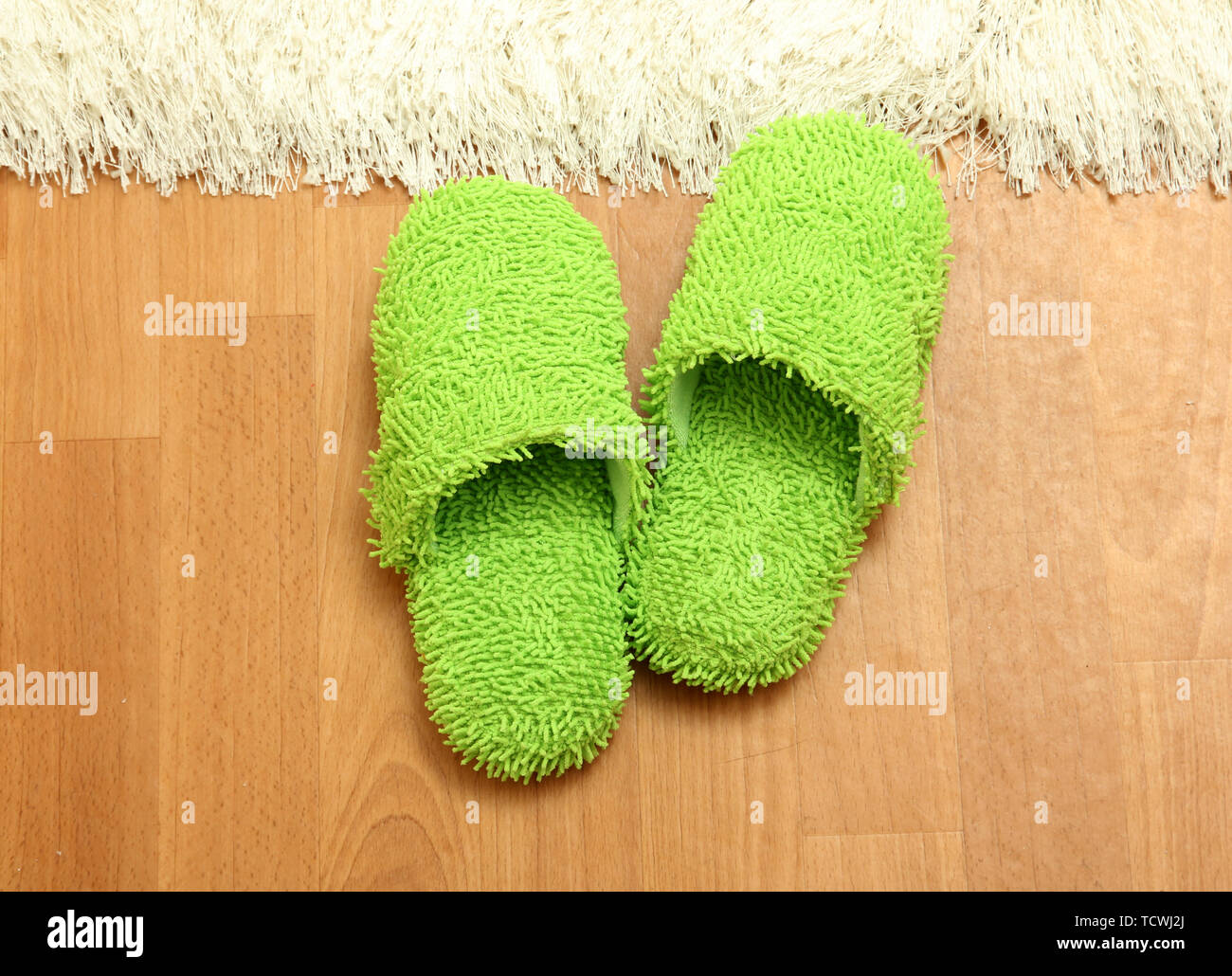 bright slippers, on floor background Stock Photo - Alamy