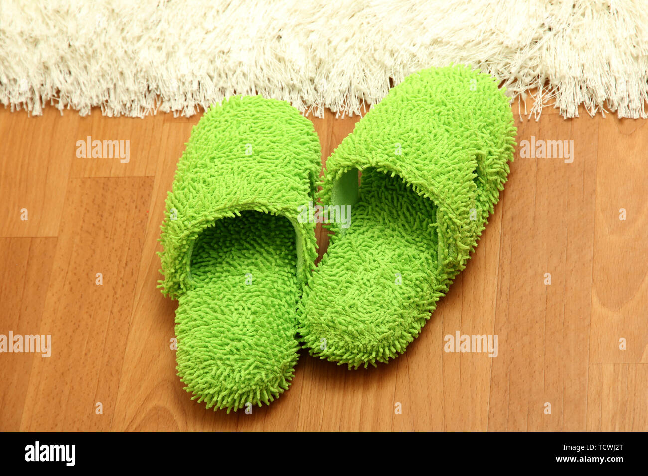 bright slippers, on floor background Stock Photo - Alamy