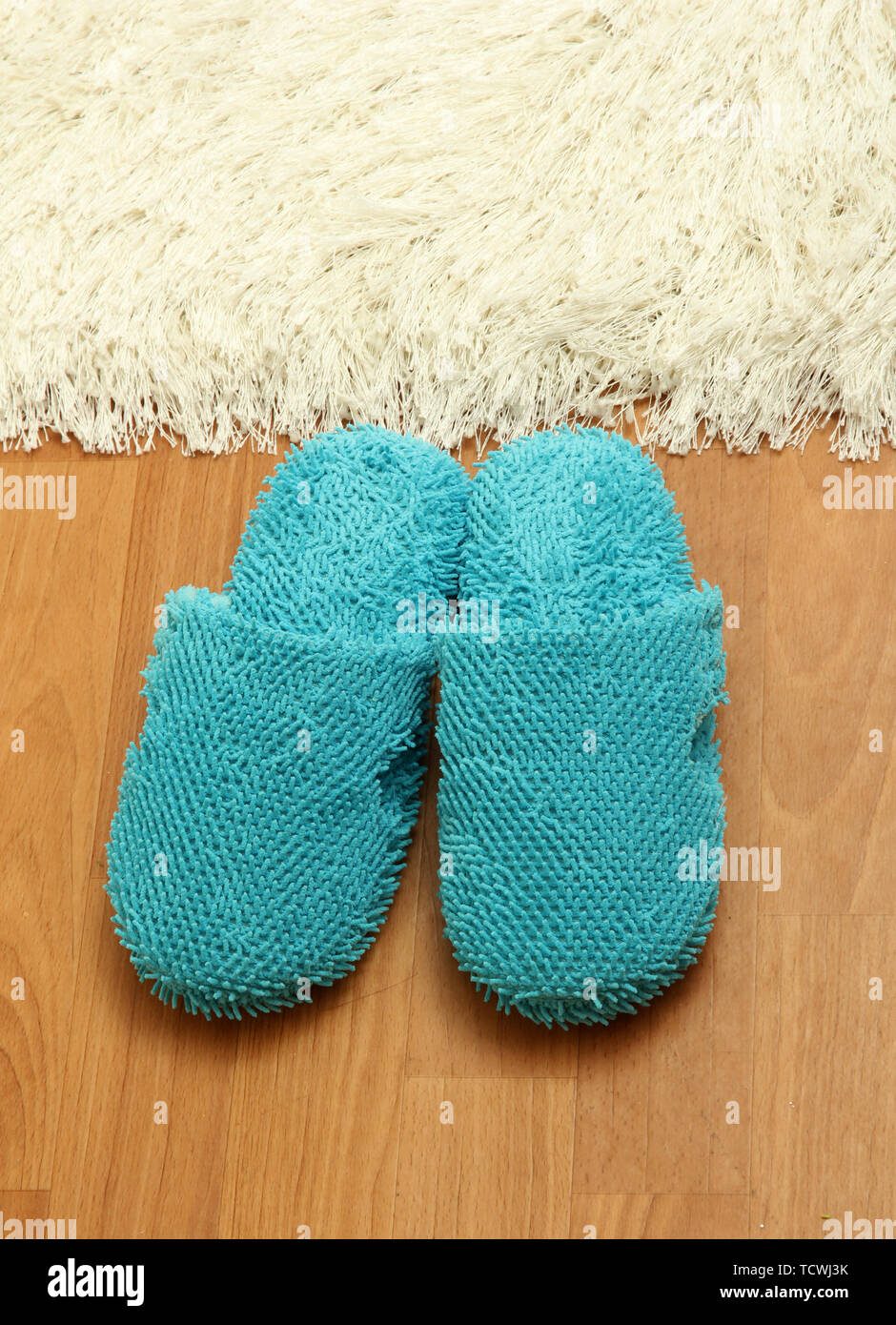 bright slippers, on floor background Stock Photo - Alamy