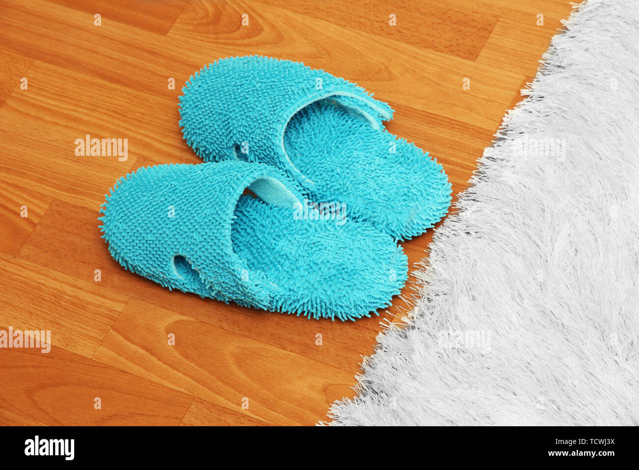 bright slippers, on floor background Stock Photo - Alamy